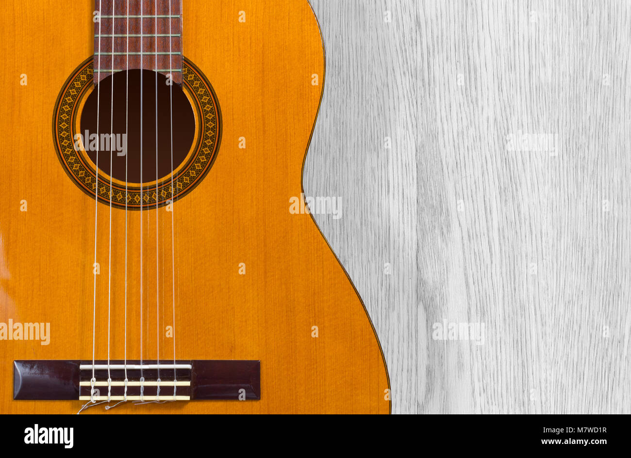 Classical guitar over a white wood texture background Stock Photo - Alamy