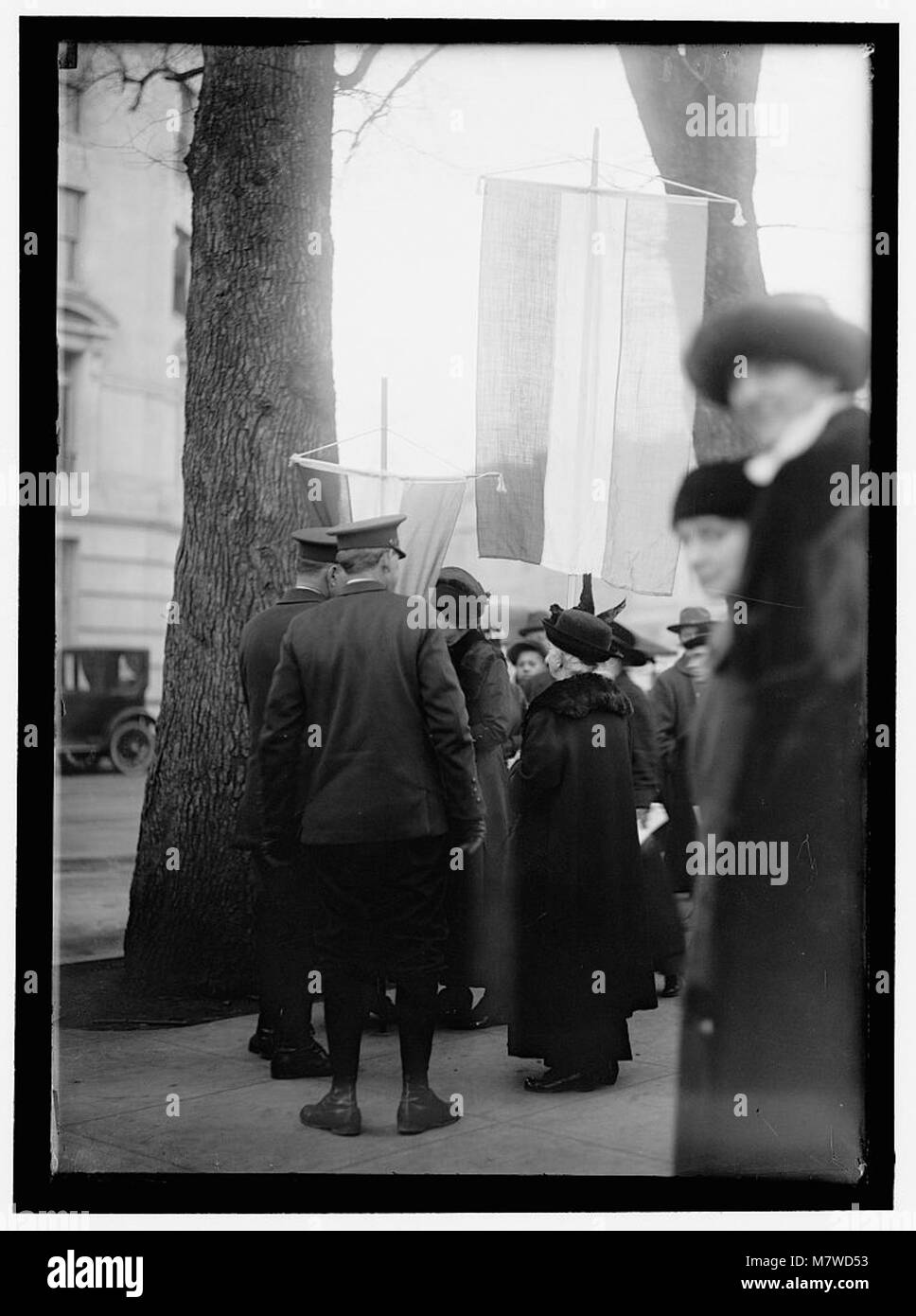 A historical photograph documenting the arrests of women suffragists ...