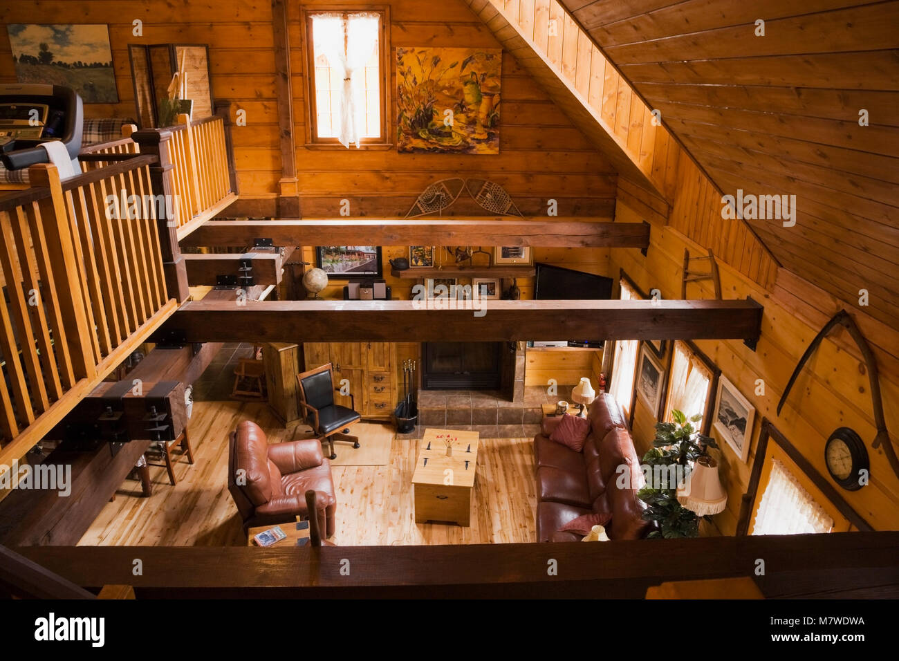 View of the living room from the mezzanine inside a Canadiana cottage ...