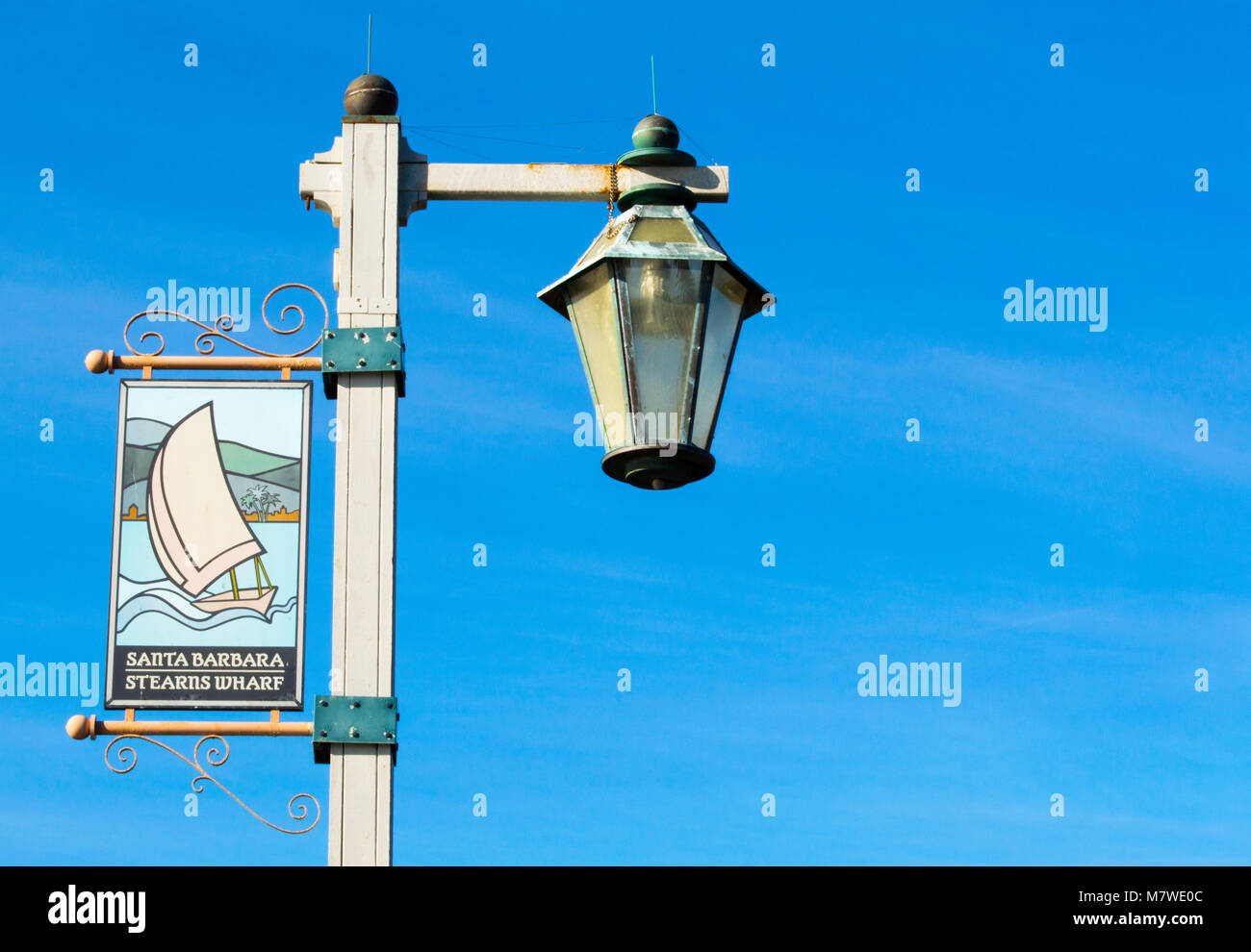 Santa Barbara Stearn's Wharf welcome banner with carriage lamp on metal ...