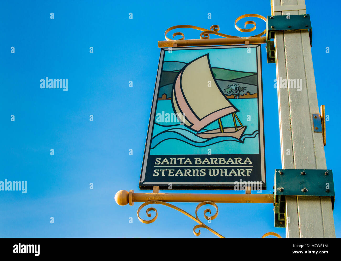 Santa Barbara Stearn's Wharf welcome banner on metal post under bright ...