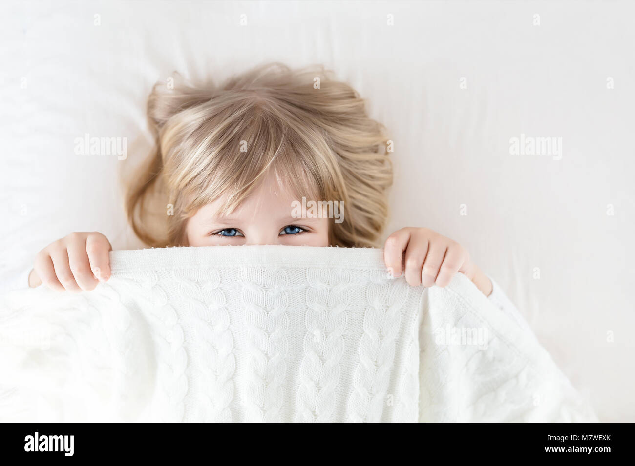 Child peek bed hi-res stock photography and images - Alamy