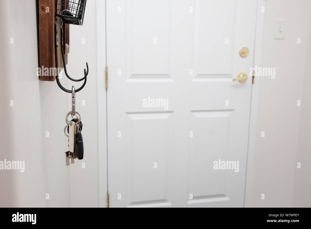 entryway of a home with front door, keys and shelf Stock Photo - Alamy