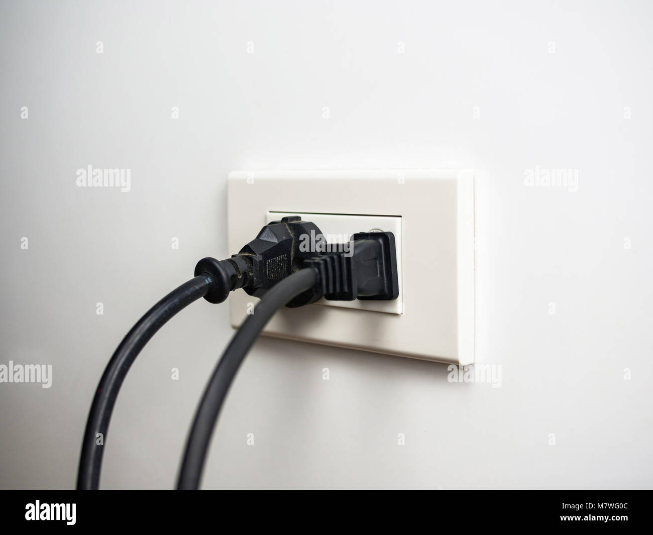 Extension cord plugged in outlet hi-res stock photography and images ...