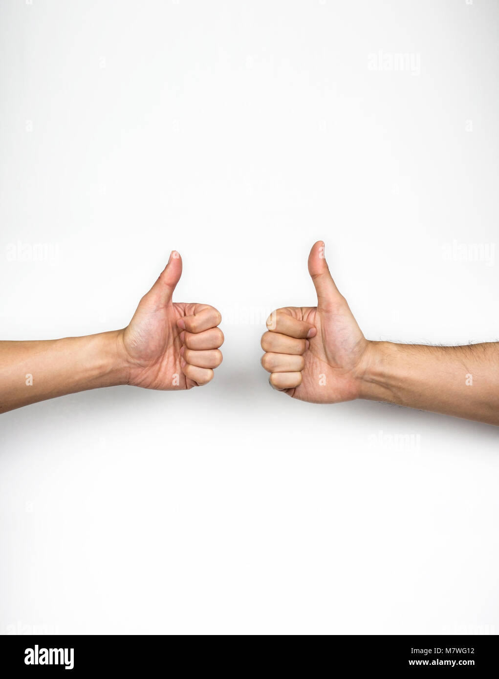 Two thumbs up on white background Stock Photo - Alamy