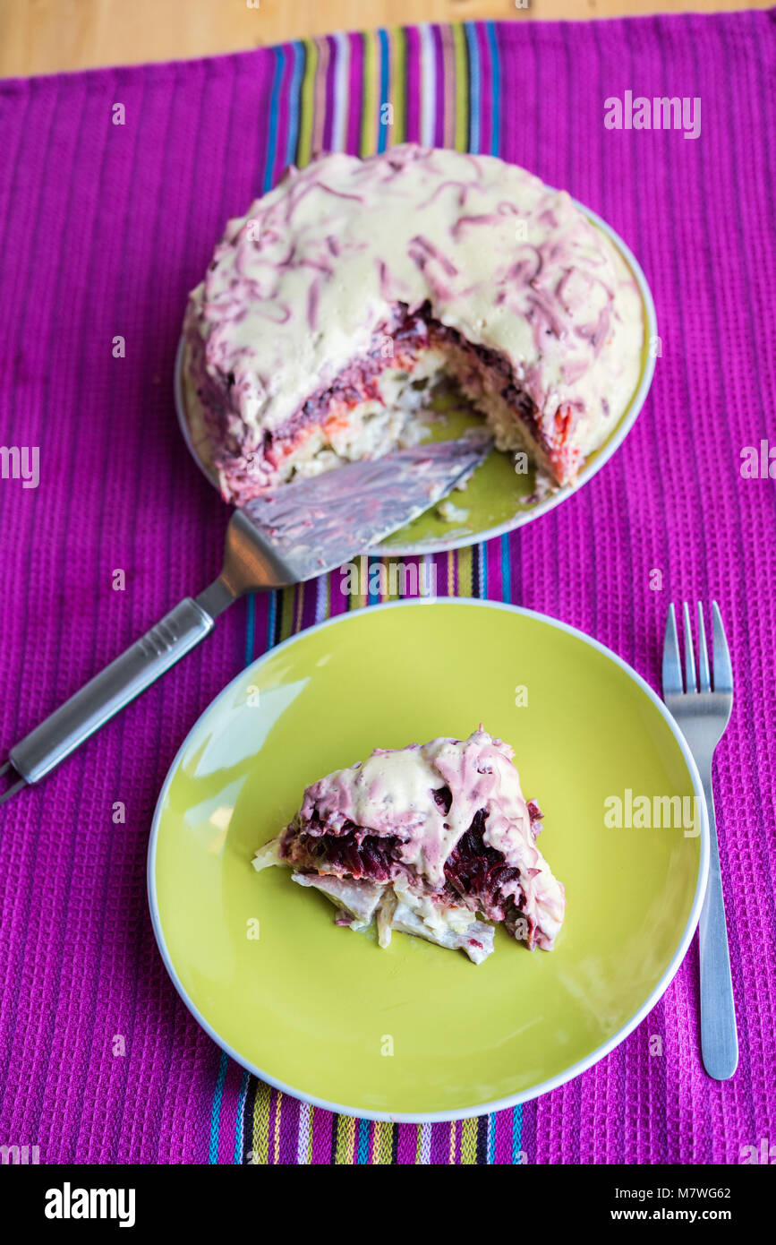 Russian Dressed Herring sliced on a plate and ready to eat - Herring ...