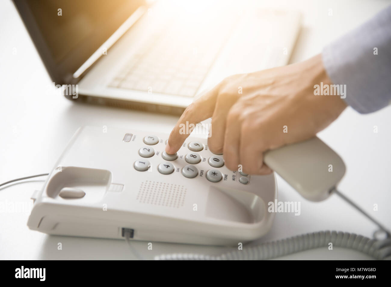 businessman dial digital telephone with office background Stock Photo ...