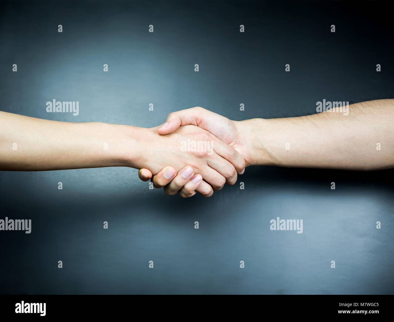 Two handed shake hi-res stock photography and images - Alamy