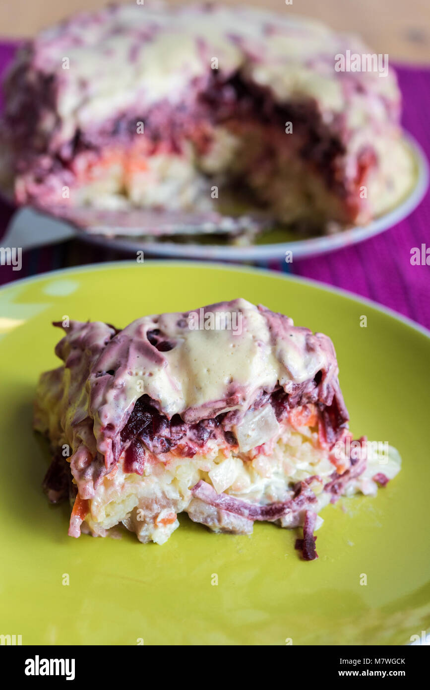 Russian Dressed Herring sliced on a plate and ready to eat - Herring ...