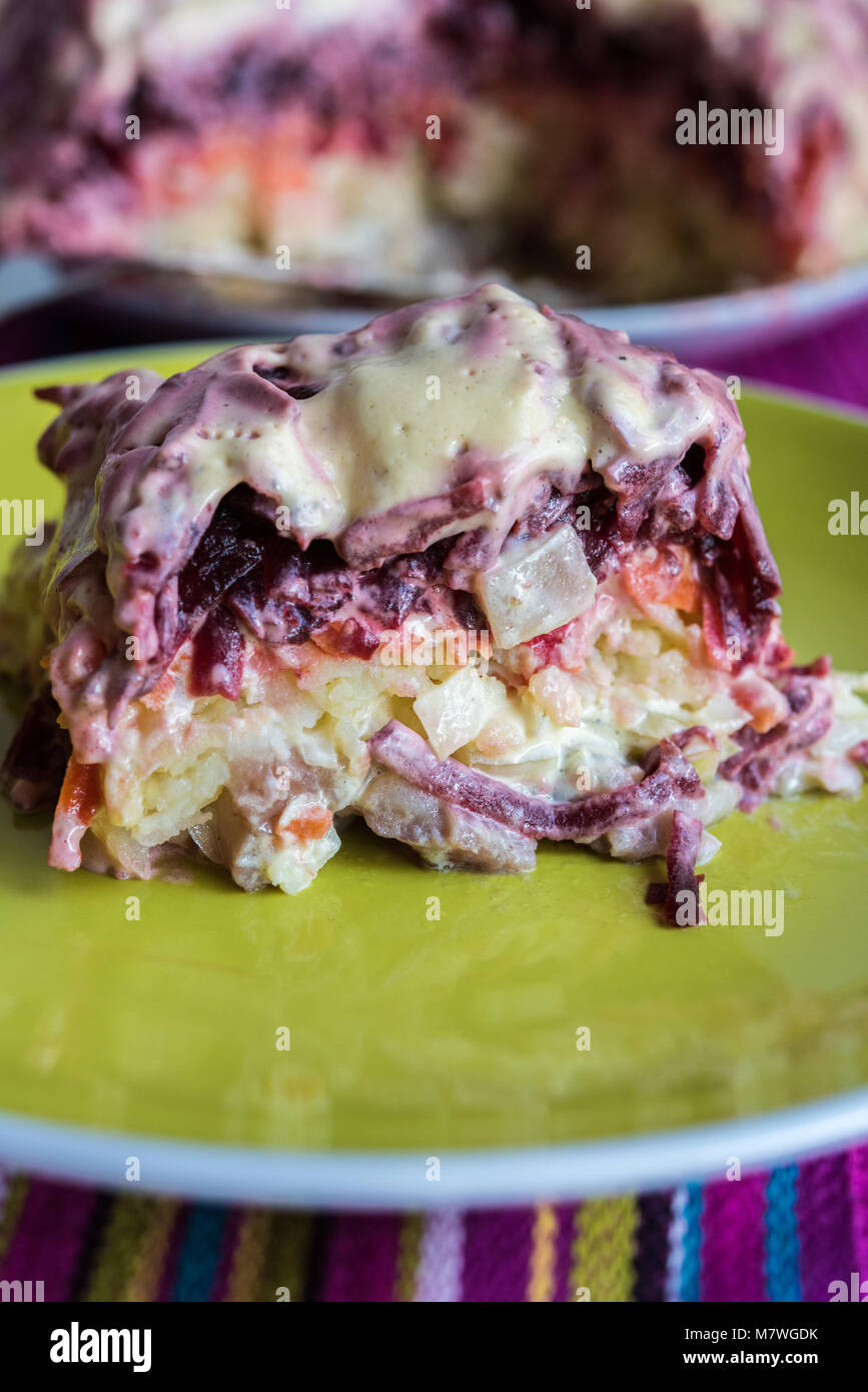 Russian Dressed Herring sliced on a plate and ready to eat - Herring ...