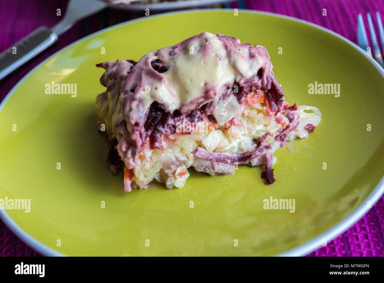 Russian Dressed Herring sliced on a plate and ready to eat - Herring ...