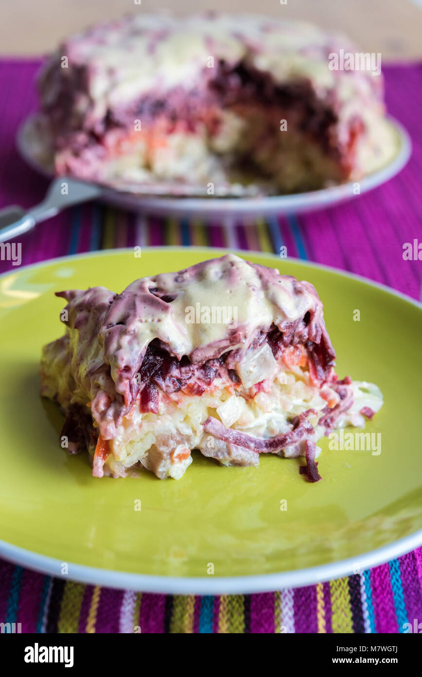 Russian Dressed Herring sliced on a plate and ready to eat - Herring ...