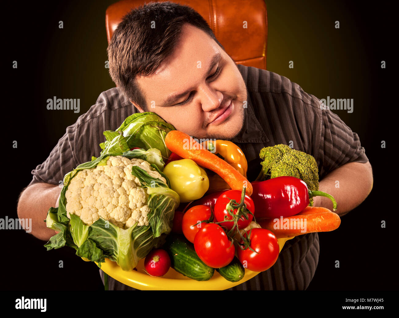 Diet fat man eating healthy food. Healthy breakfast with vegetables ...