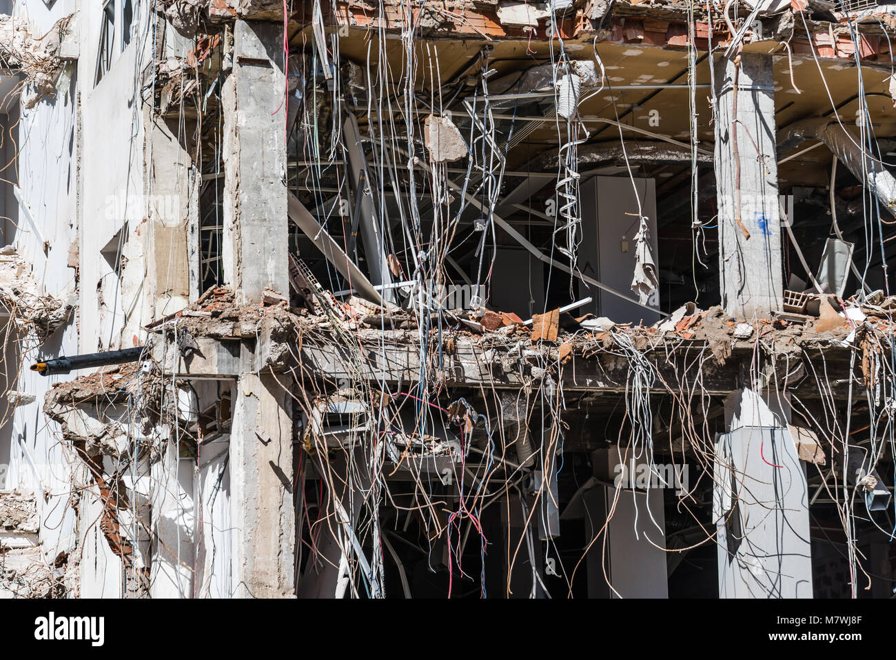 Demolition work of office building a sunny day Stock Photo - Alamy
