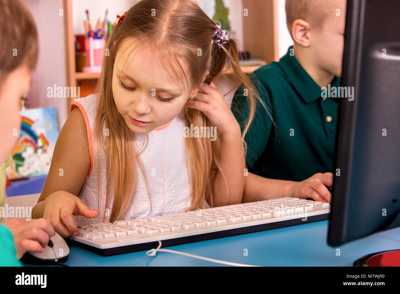 Children computer class us for education and video game Stock Photo - Alamy