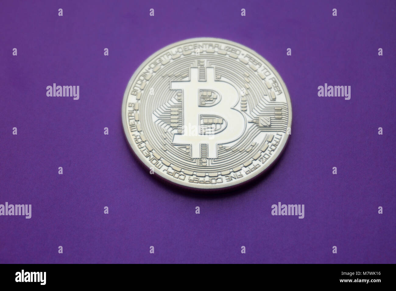 Golden Bitcoins (digital virtual money) on a purple background Stock ...