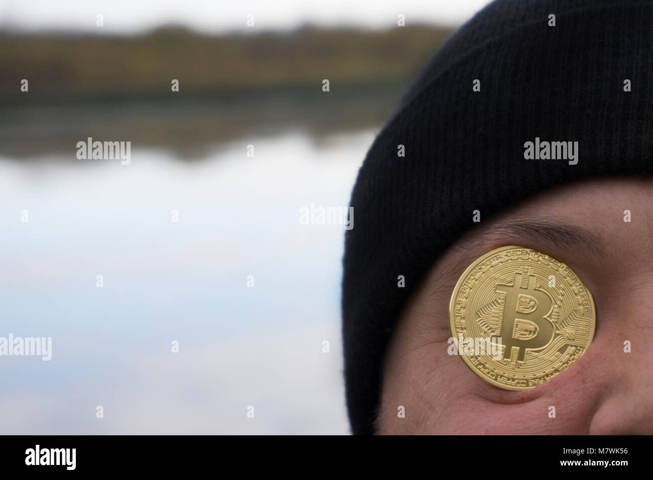 a serious man with bitcoin (new virtual money Stock Photo - Alamy