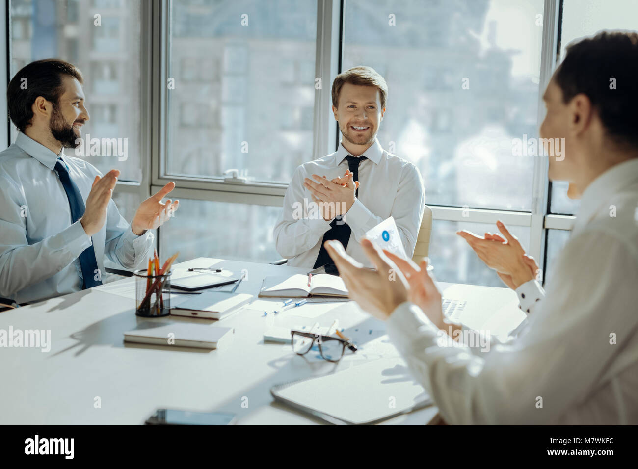 Happy office workers clapping hands celebrating new agreement Stock ...