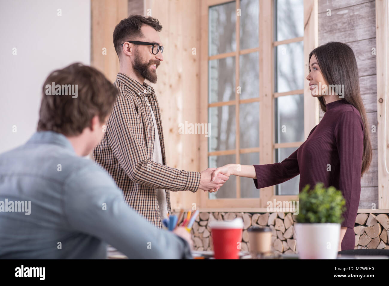 Joyful positive people greeting each other Stock Photo - Alamy