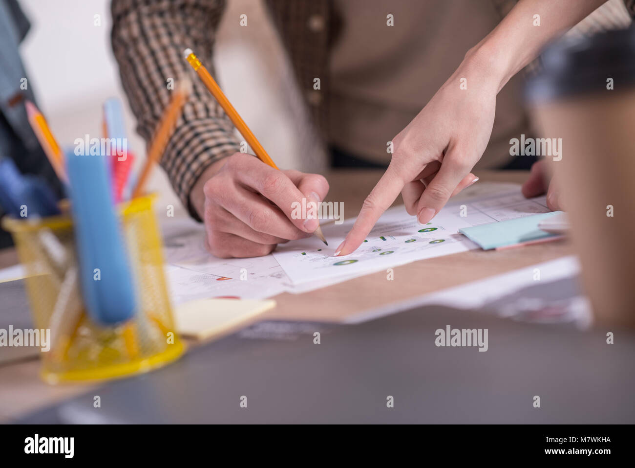 Close up of a female finger pointing at the document Stock Photo - Alamy