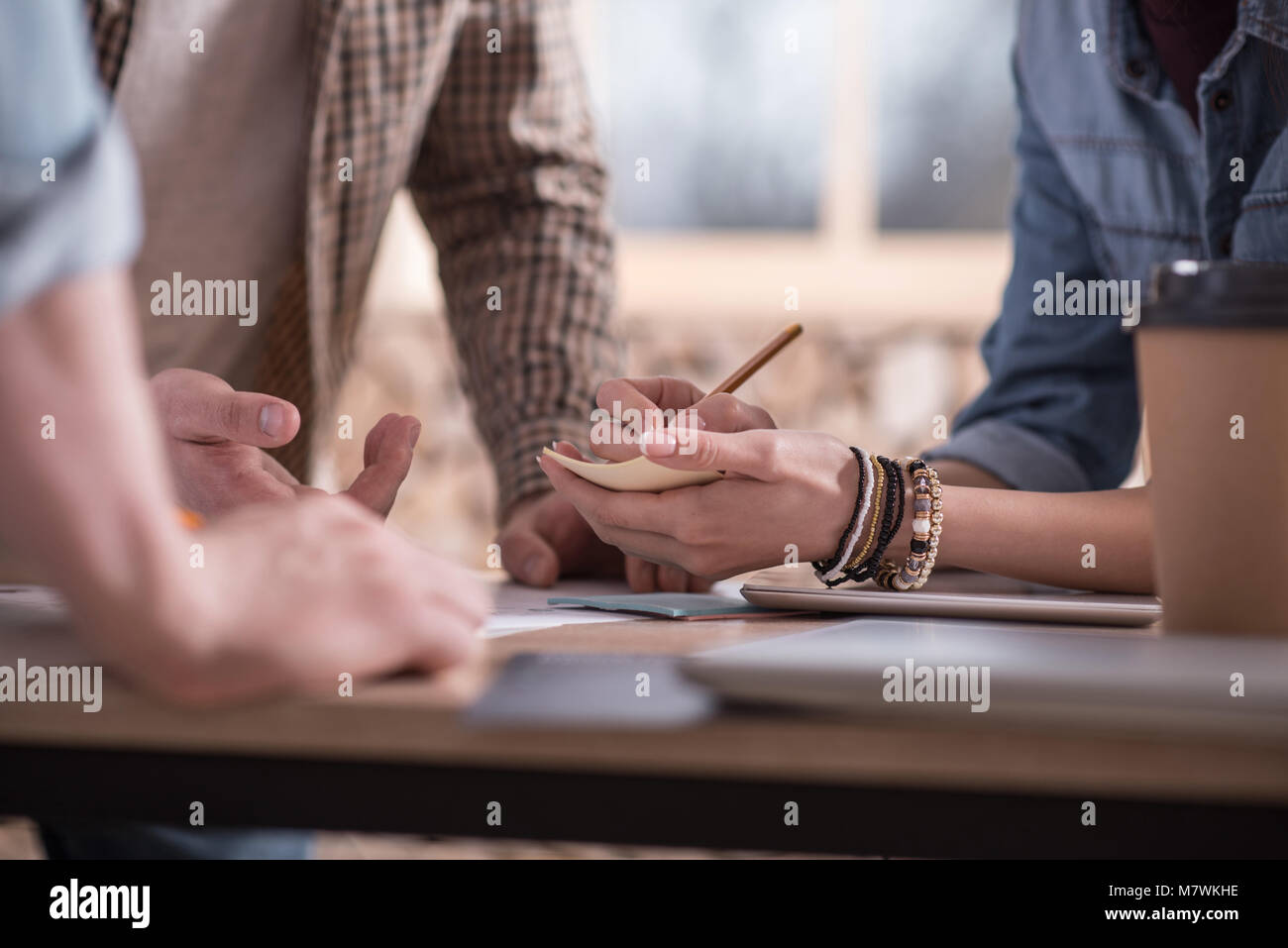 Nice young woman taking notes Stock Photo - Alamy