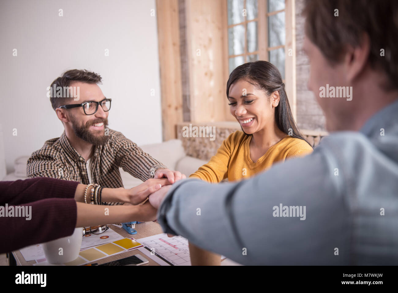 Joyful positive people showing their unity Stock Photo - Alamy