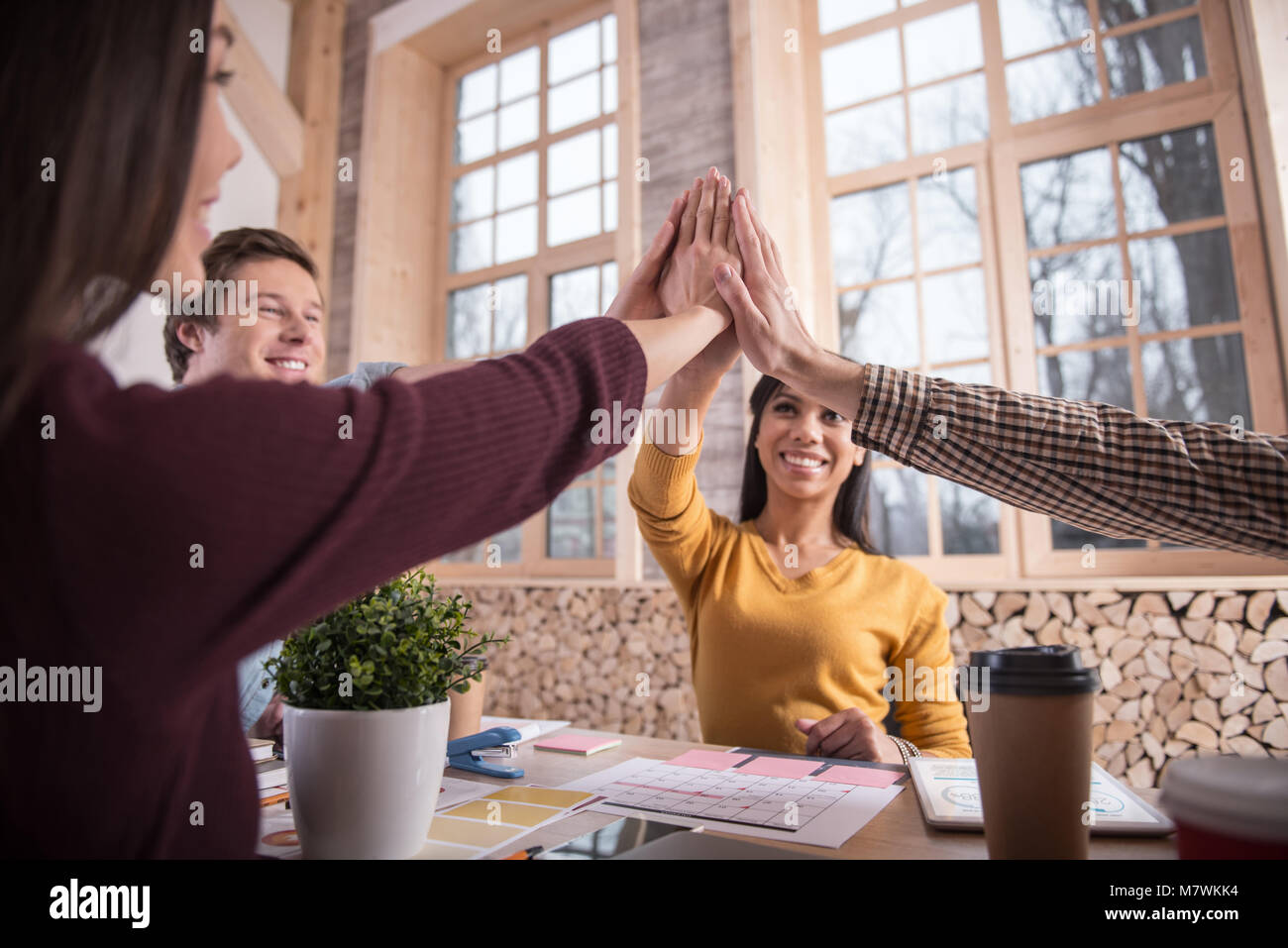 Close up of high five Stock Photo - Alamy