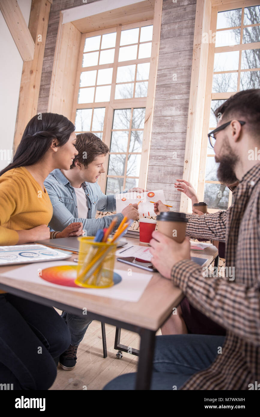 Smart young people exchanging ideas Stock Photo - Alamy