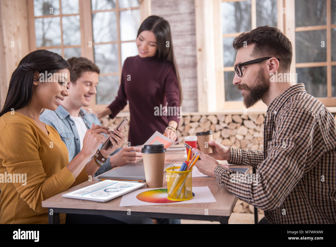 Delighted smart people sitting in the office Stock Photo - Alamy