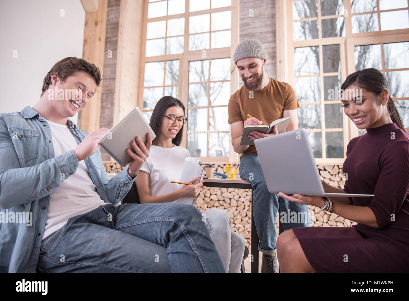 Joyful delighted people being involved in work Stock Photo - Alamy