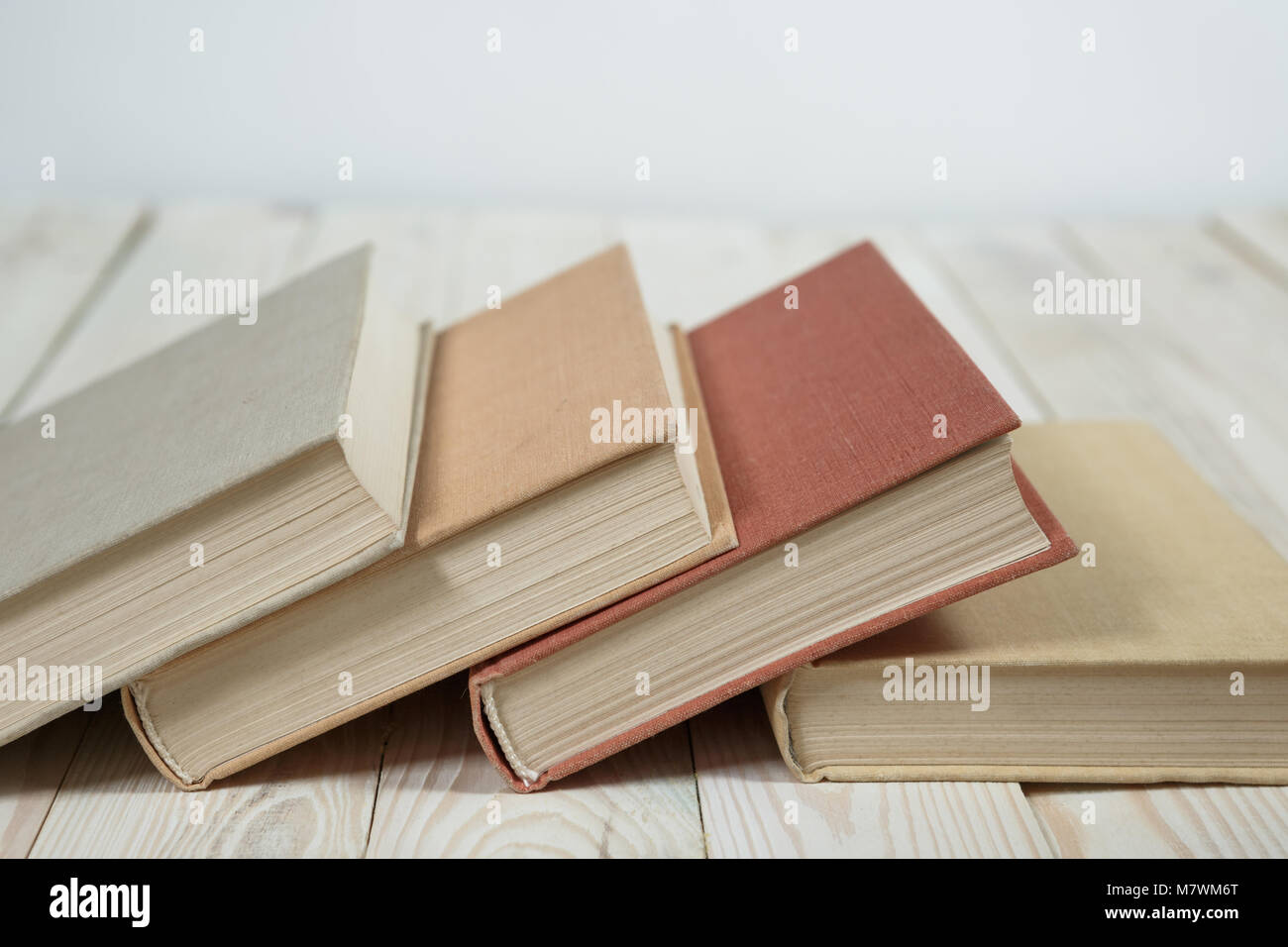 stack of old books pastel colors Stock Photo - Alamy