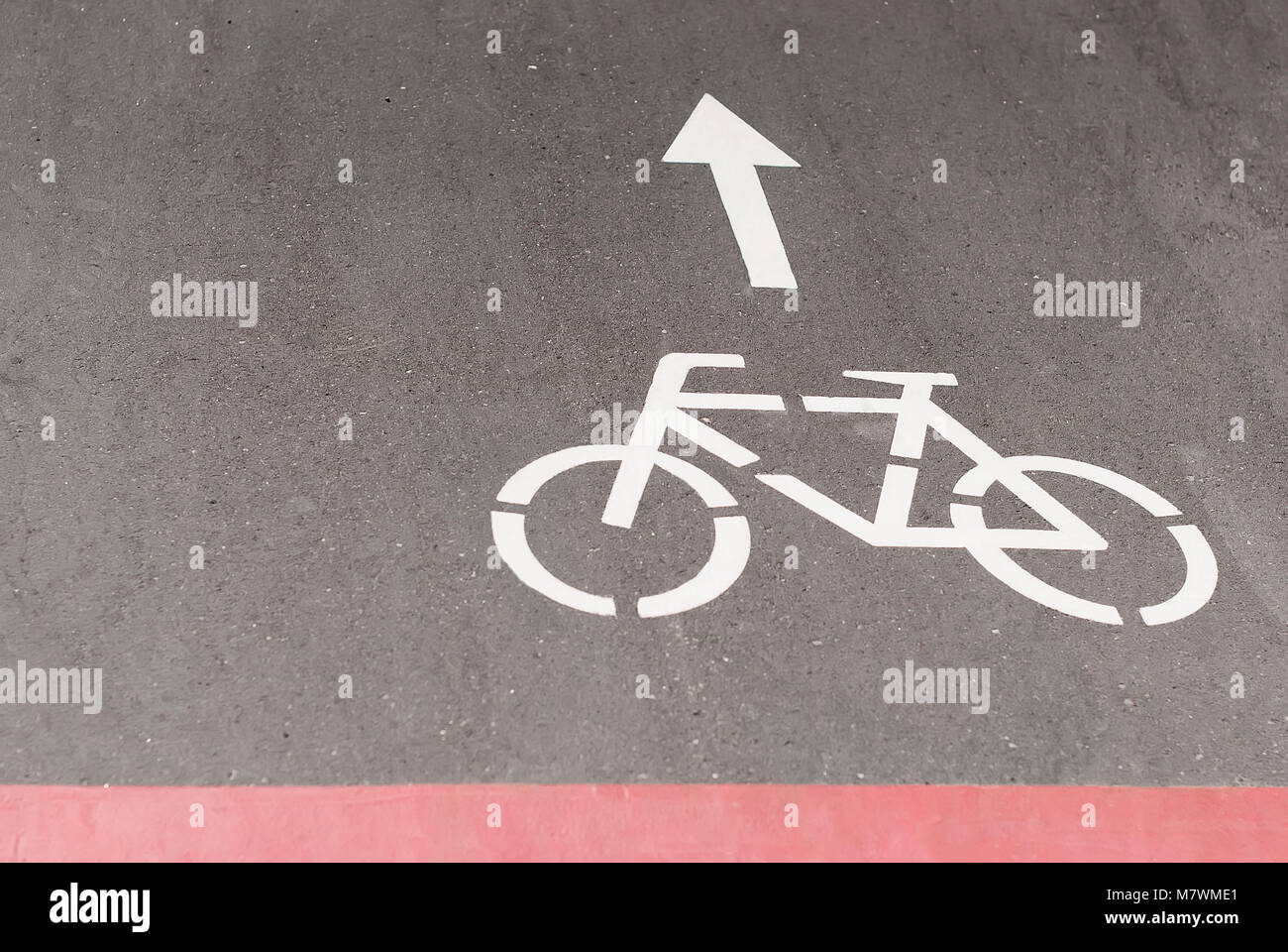 The sign of the cycle track on the asphalt and the direction of ...
