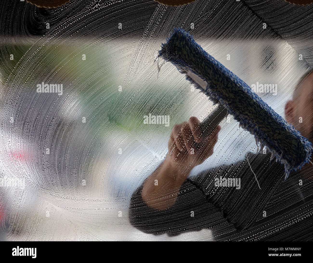 a soapy window with a squeegee cleaning the glass Stock Photo - Alamy