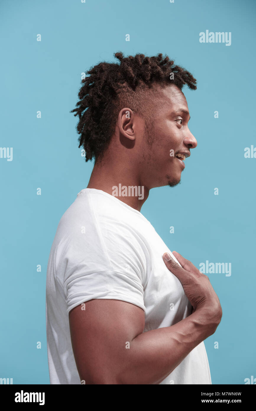 The surprised business Afro-American man standing and looking blue ...