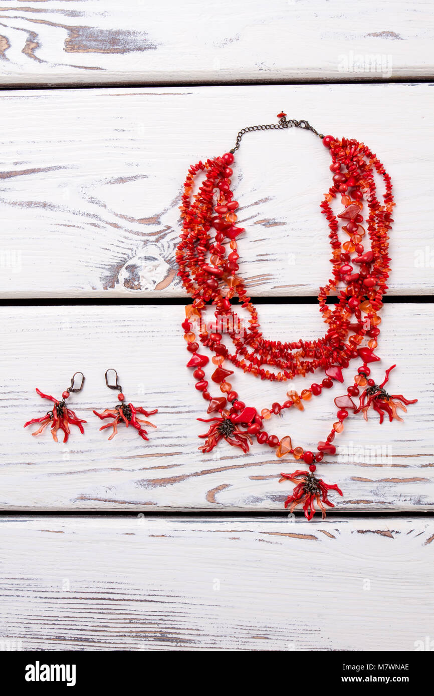 Little red beads jewelry. Necklace with polished stones Stock Photo - Alamy
