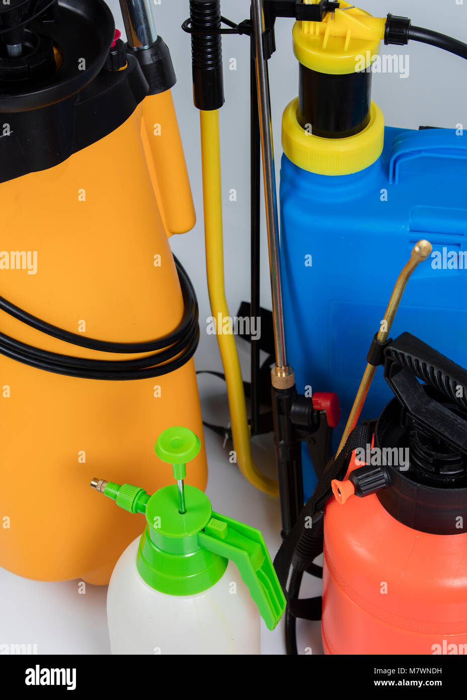 pest control sprayers on isolated white background Stock Photo - Alamy