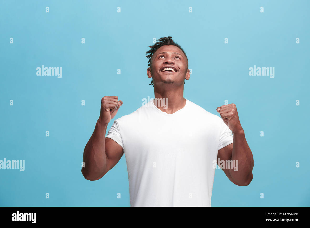 Winning success afro-american man happy ecstatic celebrating being a ...