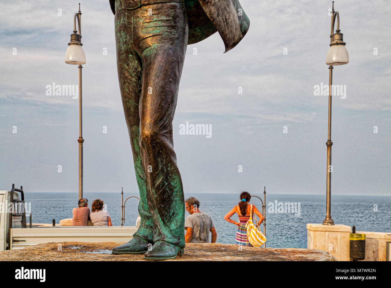 POLIGNANO (BA), ITALY - AUGUST 31, 2016: The tourists gather under the ...
