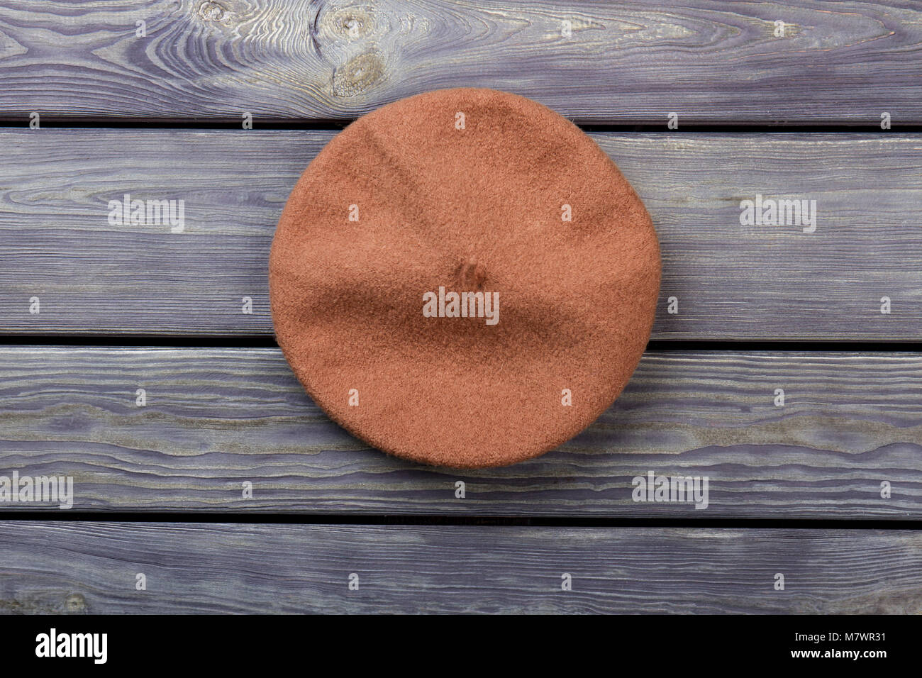 Top view beret hat. Top view, flat lay, wooden desk surface background ...