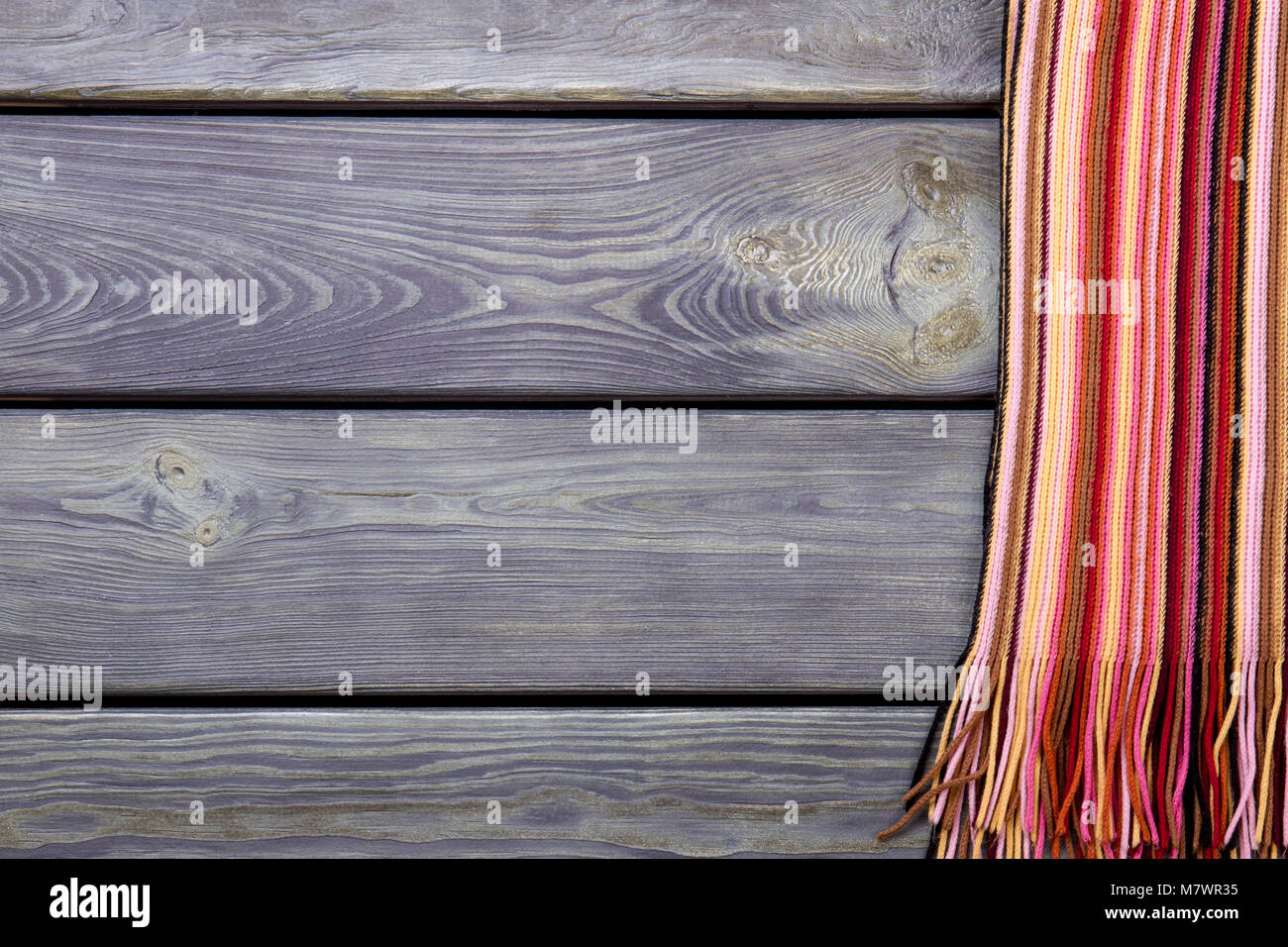 Close up striped wool clothes. Flat lay, top view. Black background ...