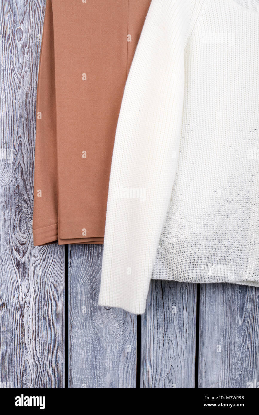 Winter clothes material close up. Grey wooden desk surface background ...