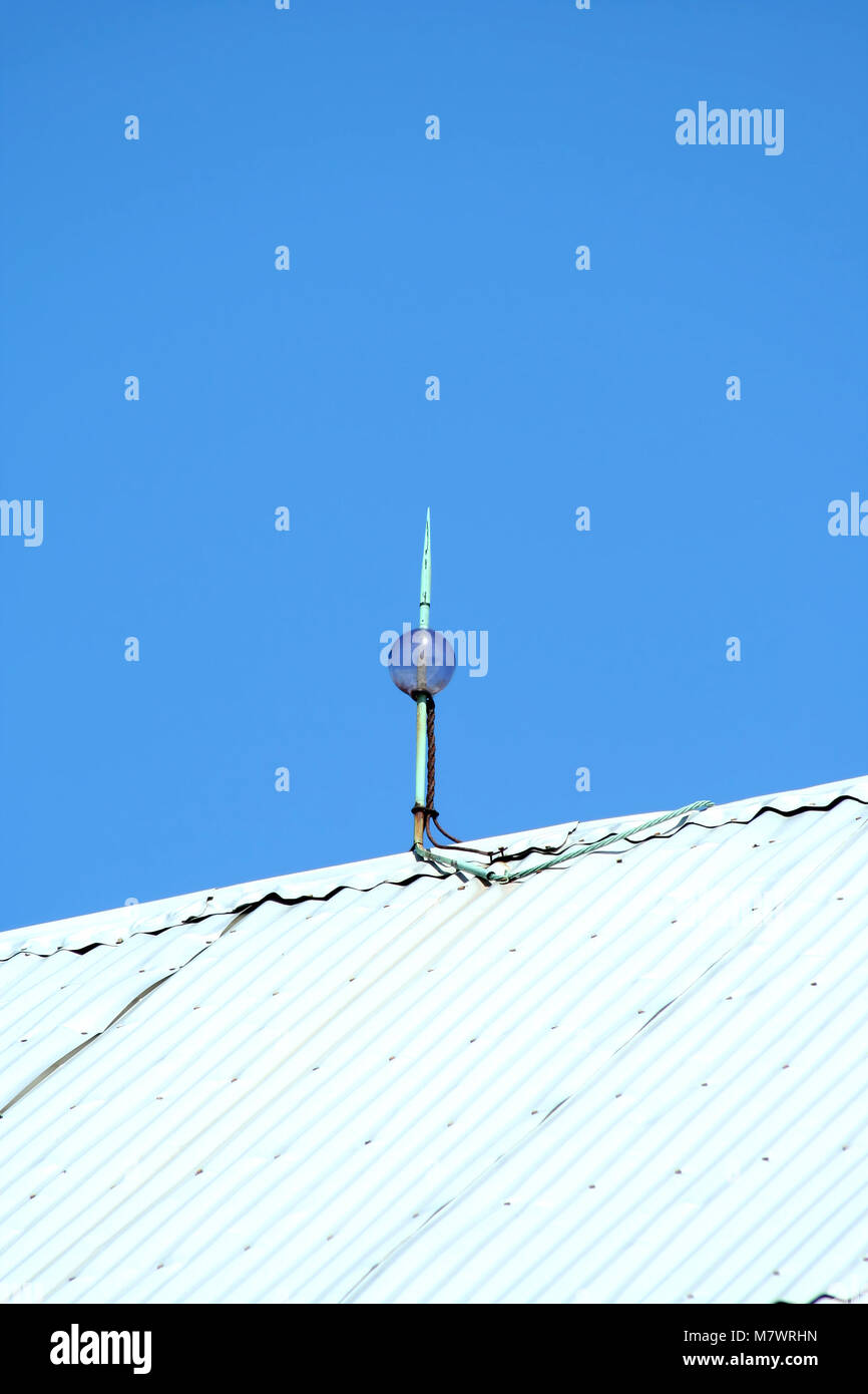 Lightning rod on top of a barn against a blue sky Stock Photo - Alamy