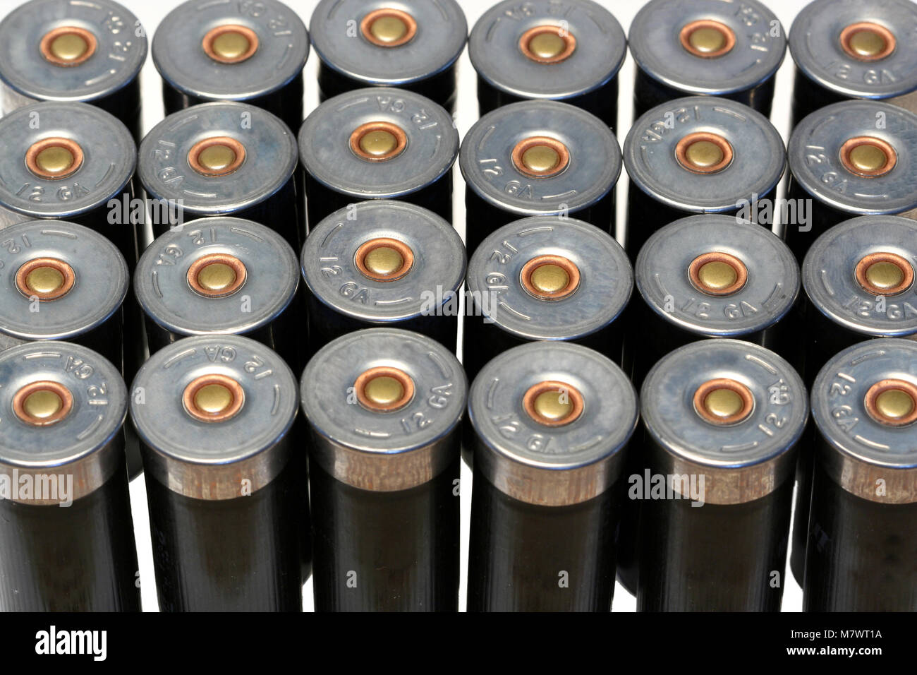 12 gage black shotgun shells background image Stock Photo - Alamy