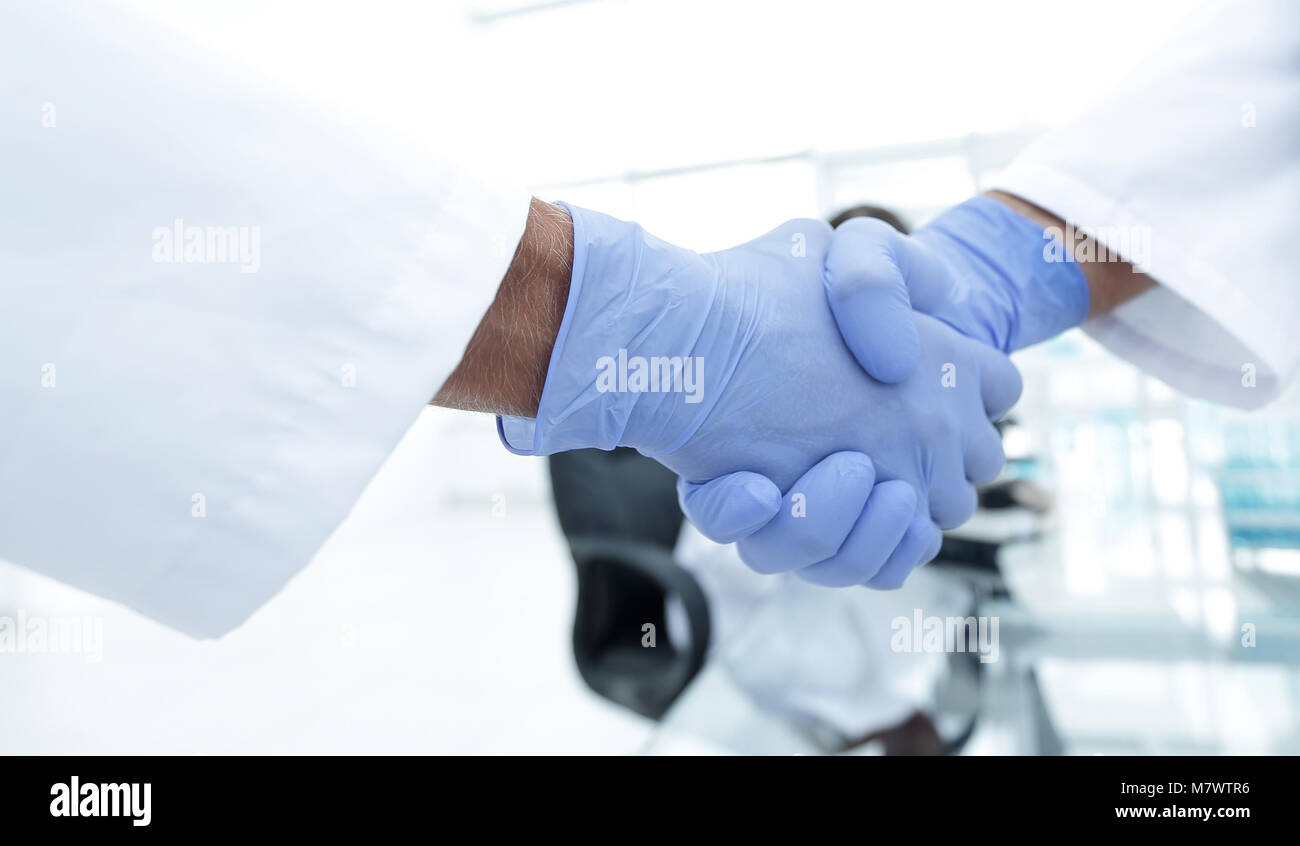hand in the medical glove (handshake Stock Photo - Alamy