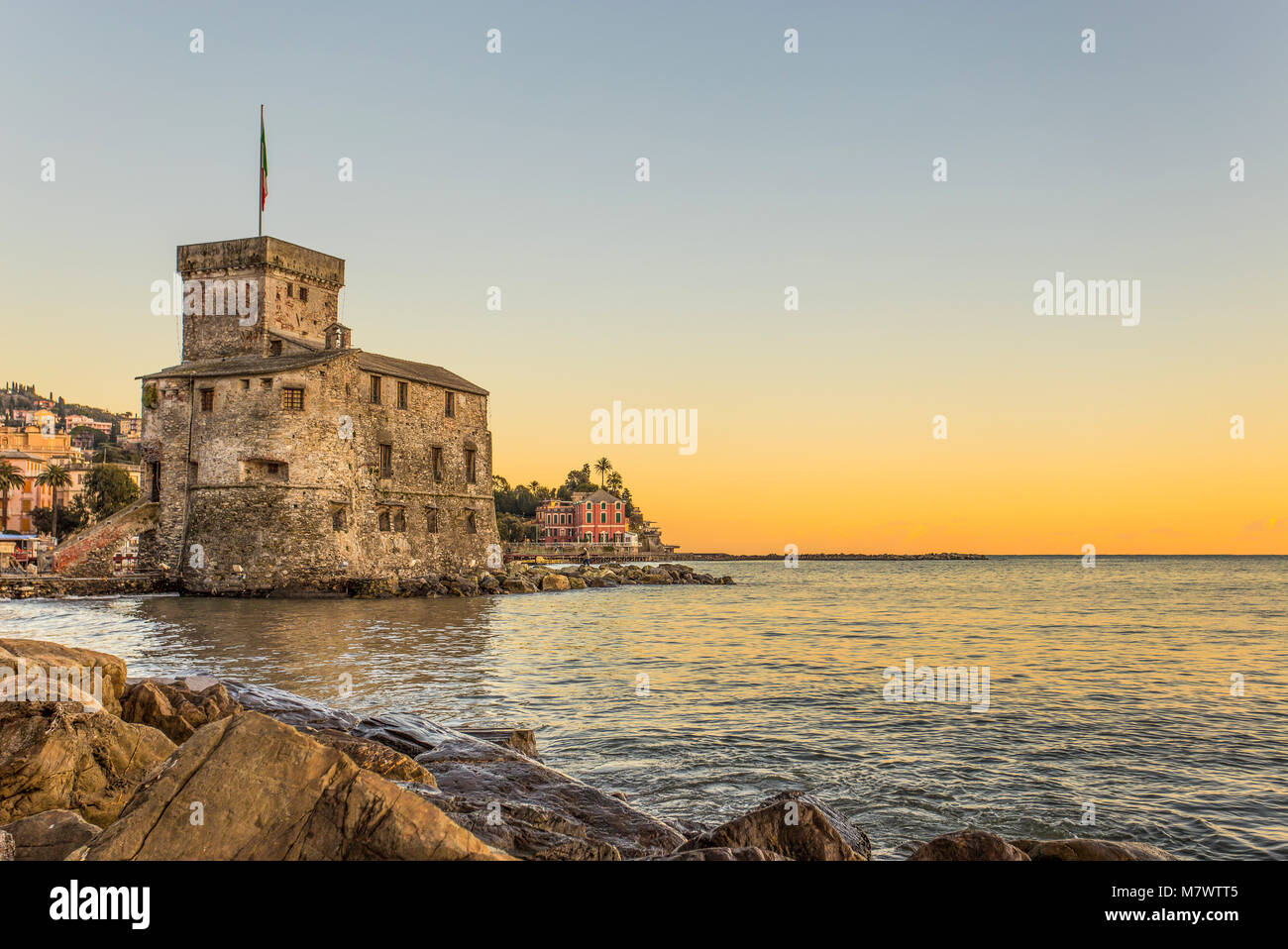 The ancient castle on the sea at sunset, Rapallo, Genoa (Genova), Italy ...