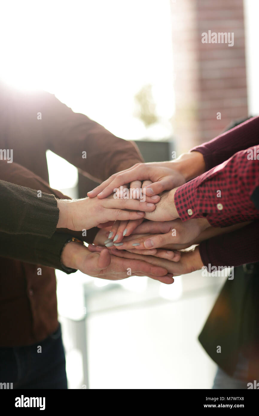 successful business team with hands clasped together Stock Photo - Alamy