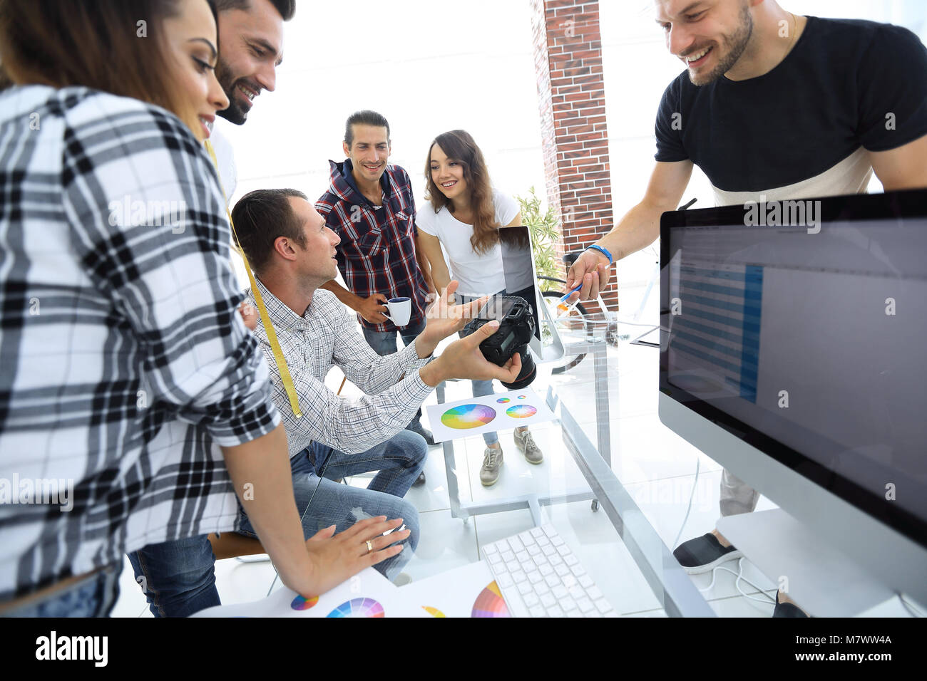 group photo of editors working in a modern office Stock Photo - Alamy