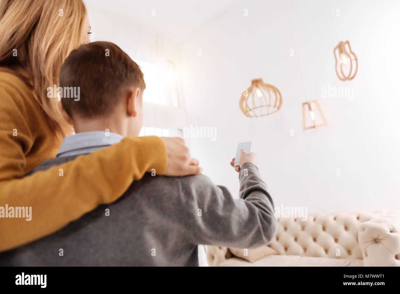 Pleasant smart boy using a digital device Stock Photo - Alamy