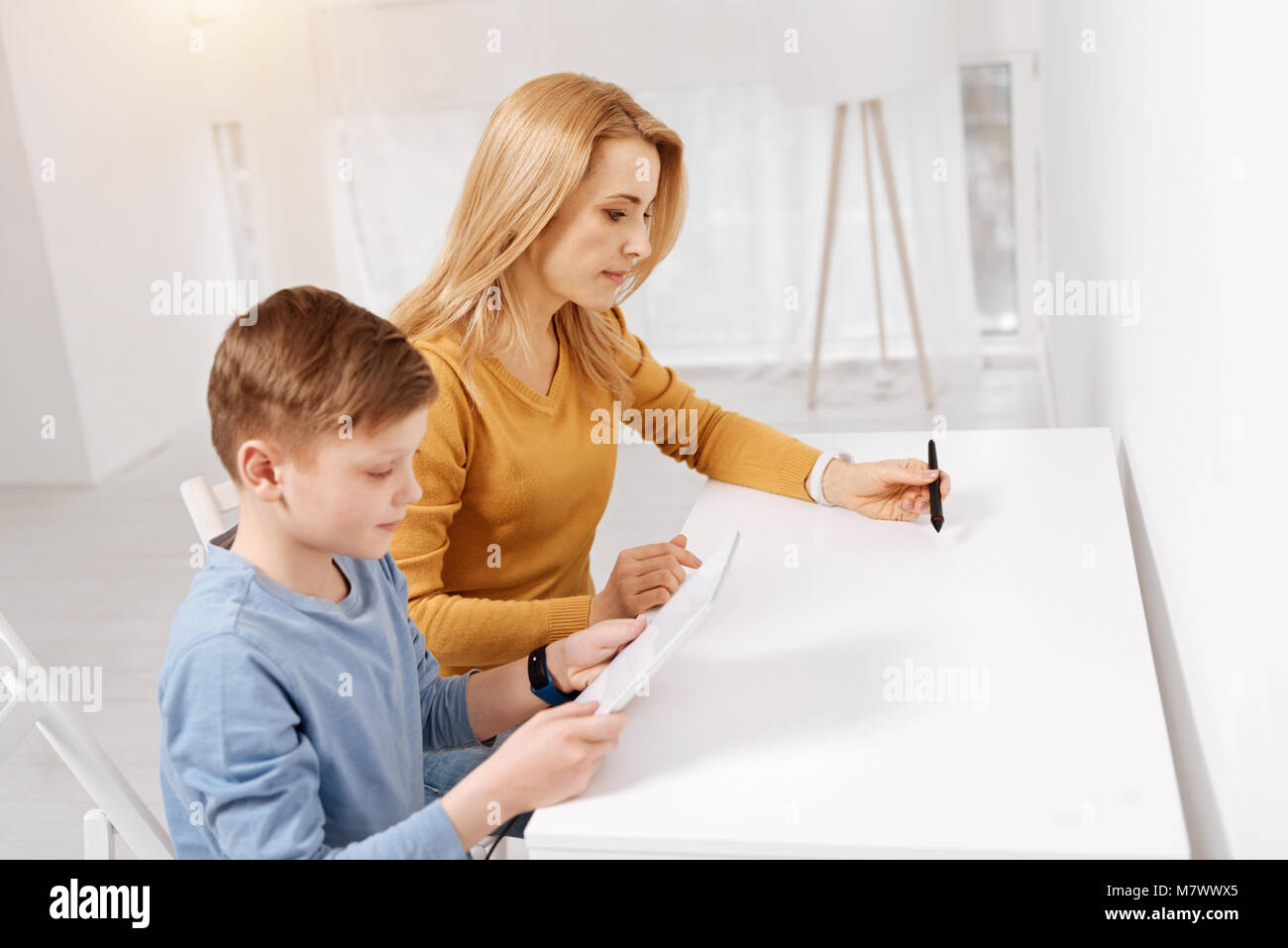 Pleasant happy woman drawing Stock Photo - Alamy
