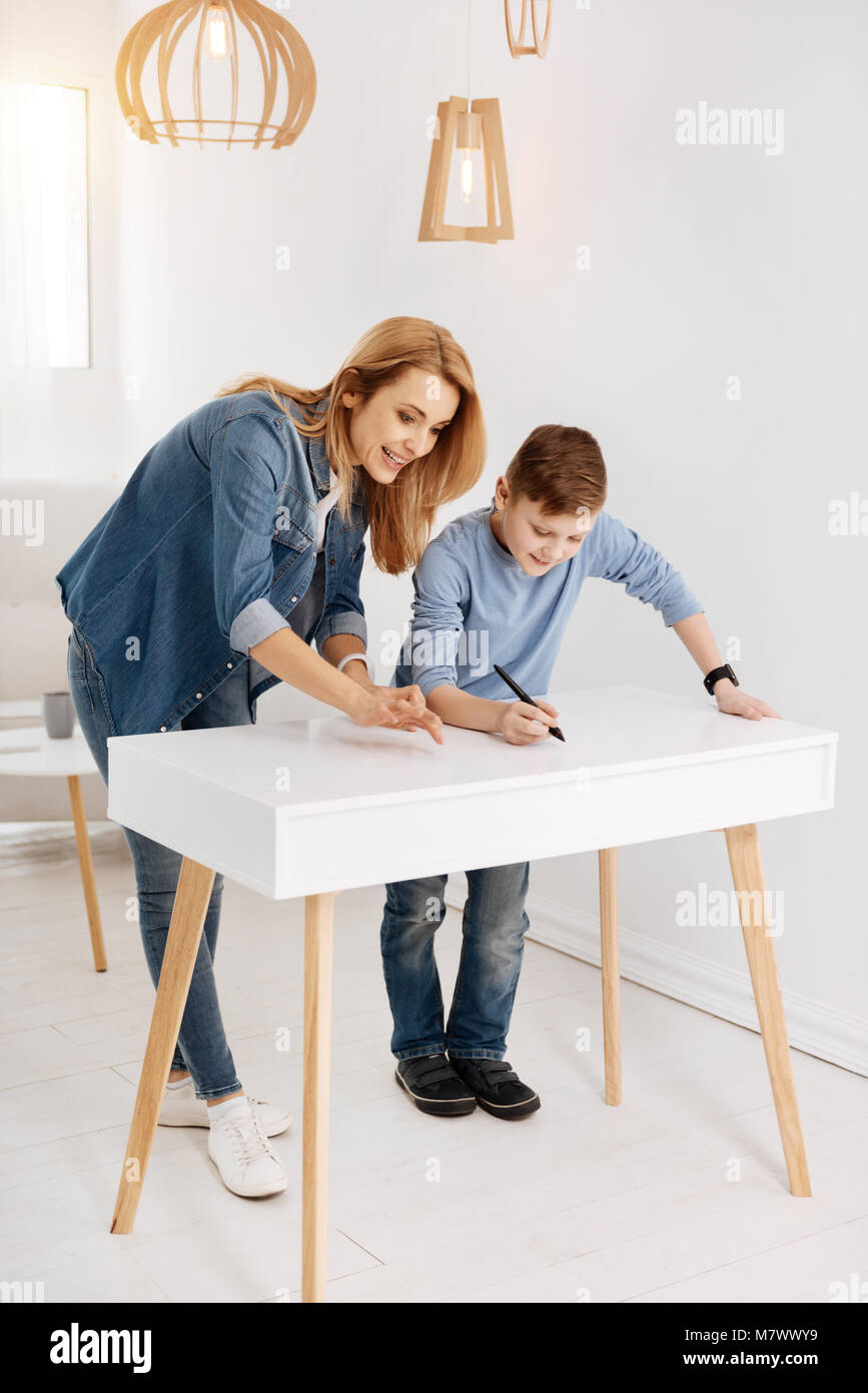 Happy talented boy drawing Stock Photo - Alamy